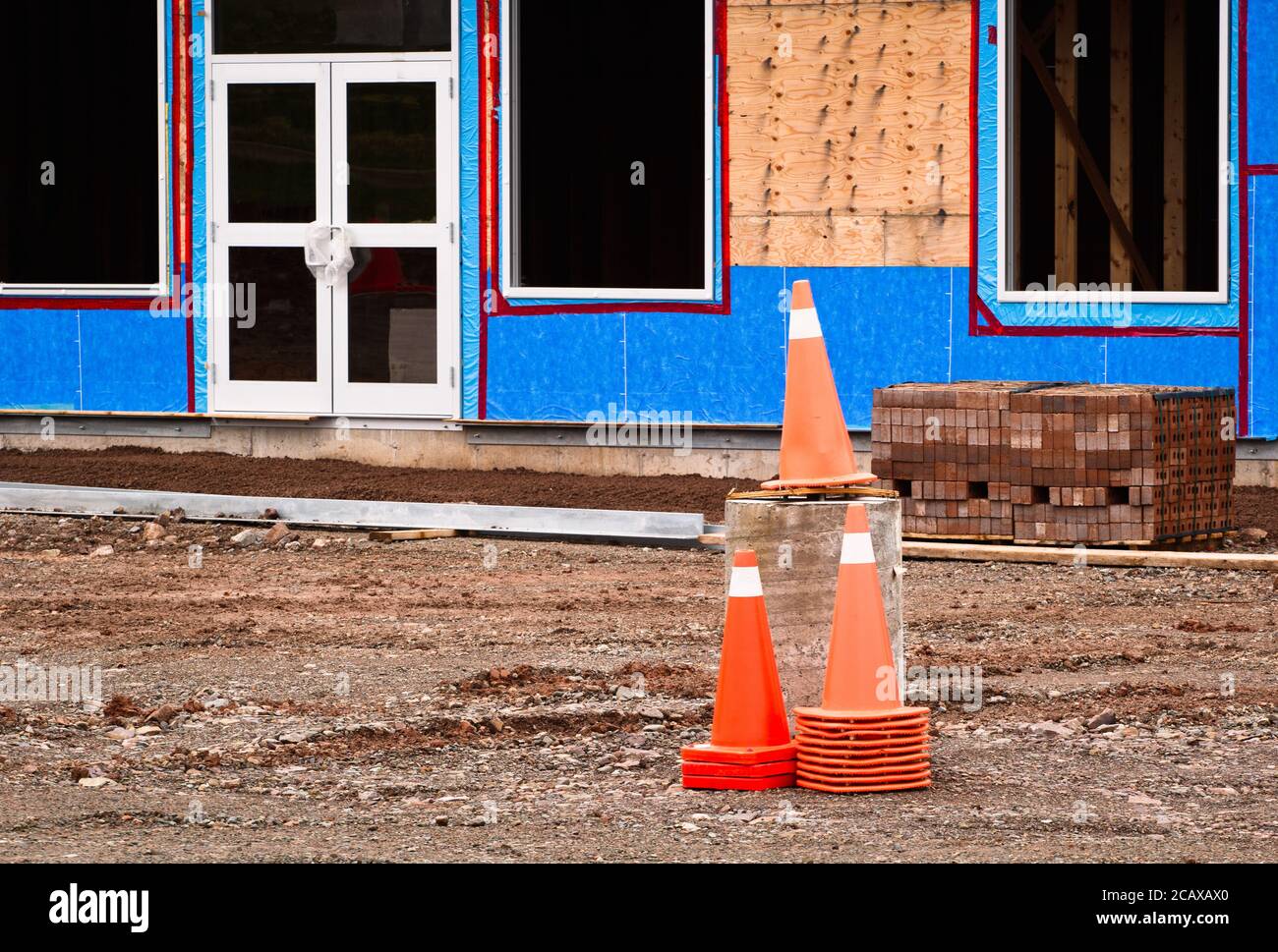 Orange safety cones on building development site Stock Photo - Alamy