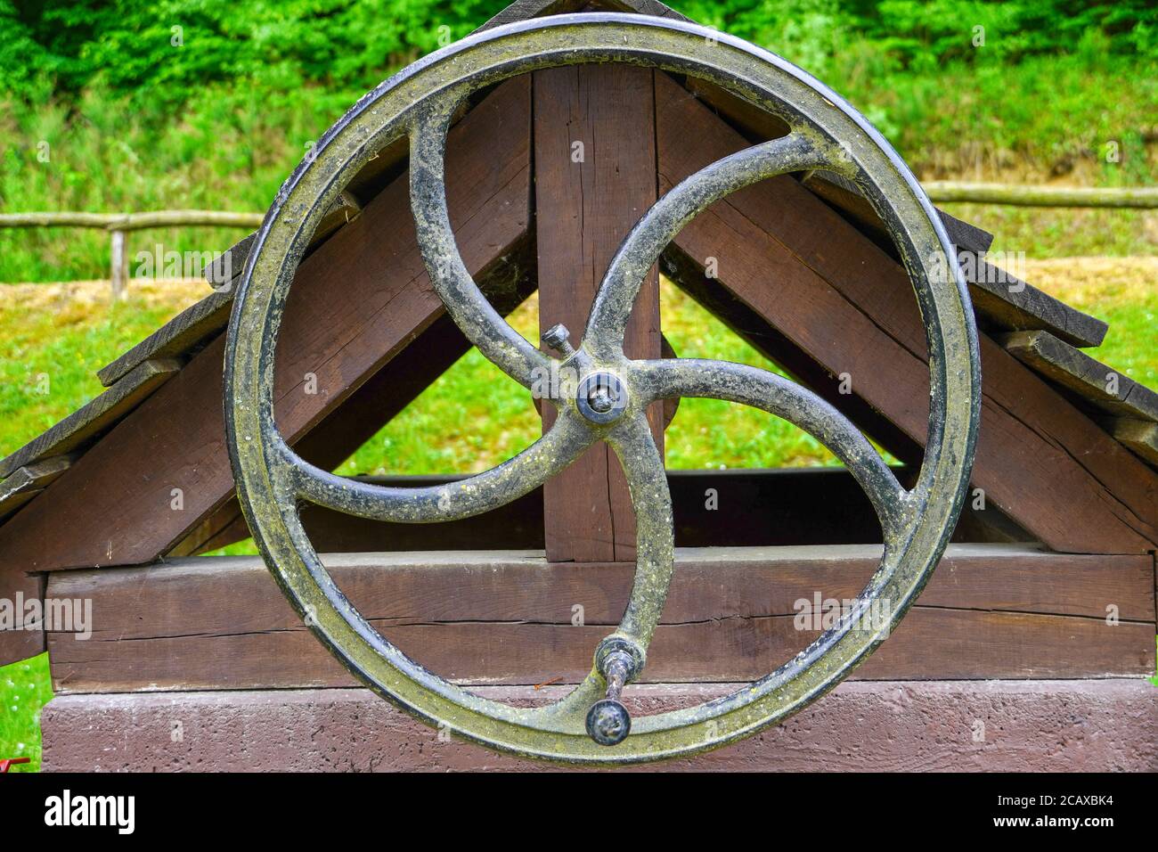Large iron wheel for the well Stock Photo - Alamy