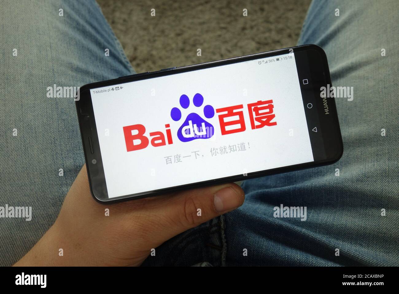 Man holding smartphone with Baidu, Inc. company logo Stock Photo - Alamy