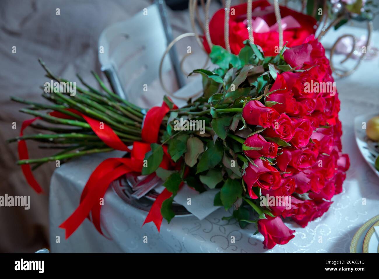 Big bouquet of one hundred big red roses flowers . A bouquet of flowers ...