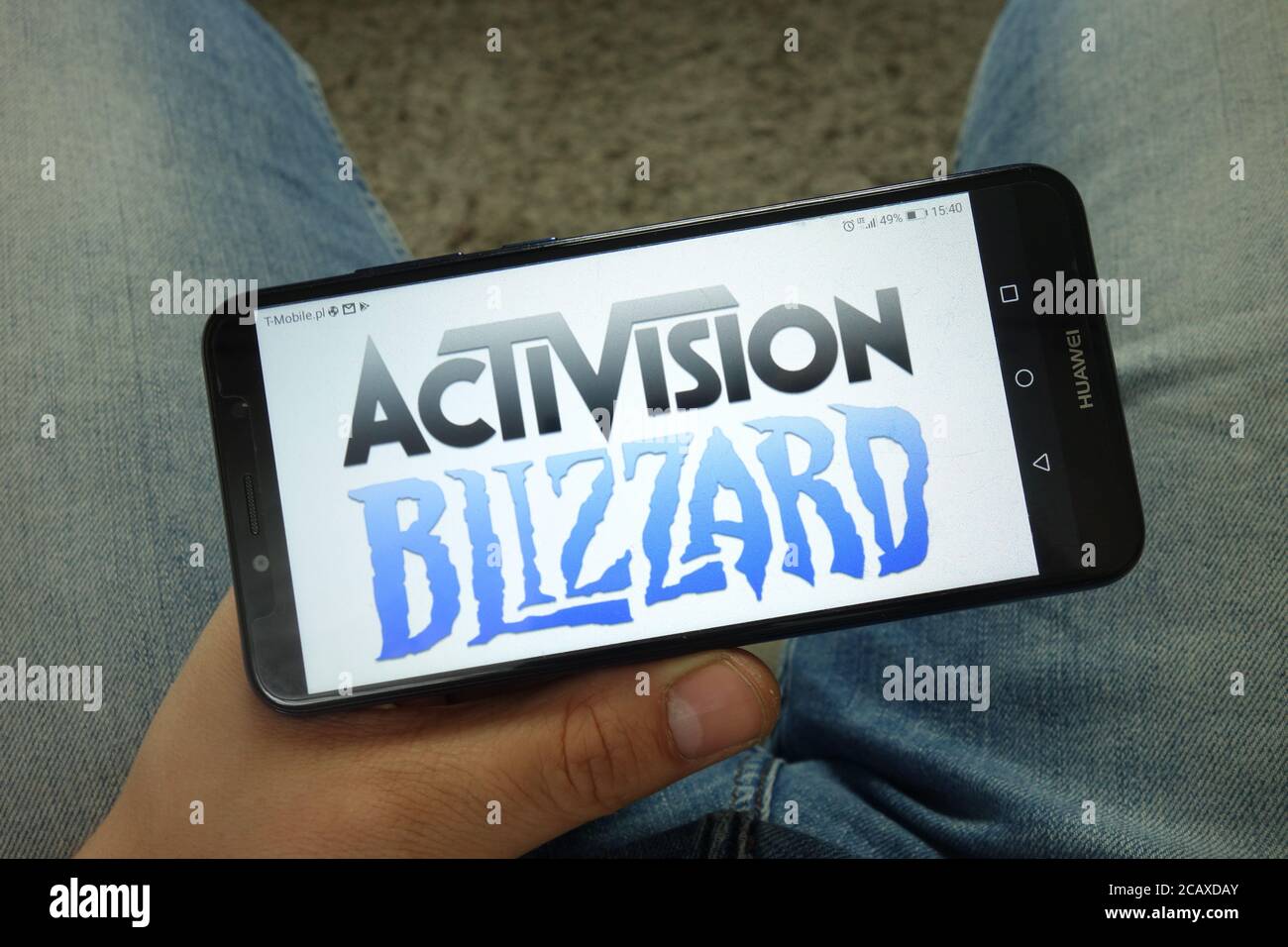 Man holding smartphone with Activision Blizzard, Inc. logo Stock Photo ...