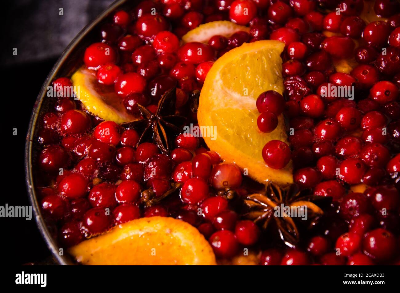 metal pot on the stove. Oranges and cranberries in mulled wine Stock ...