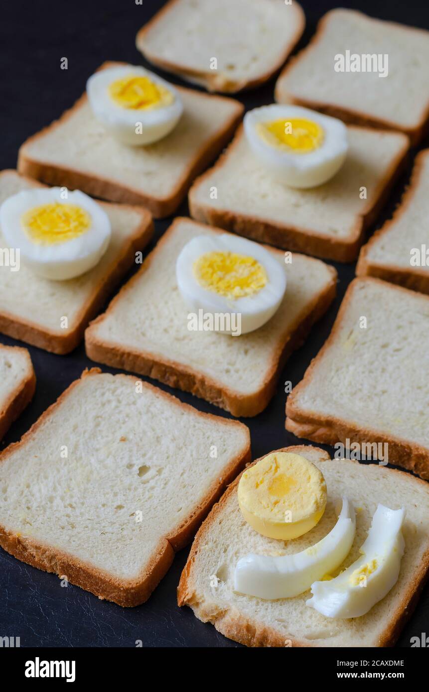 Boiled eggs and toast bread. Five pieces of chicken eggs on top on ...