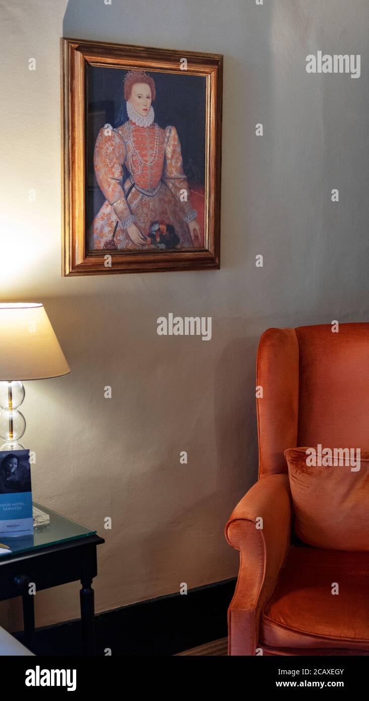 Traditional Tudor period style room with gold frame painting of ...