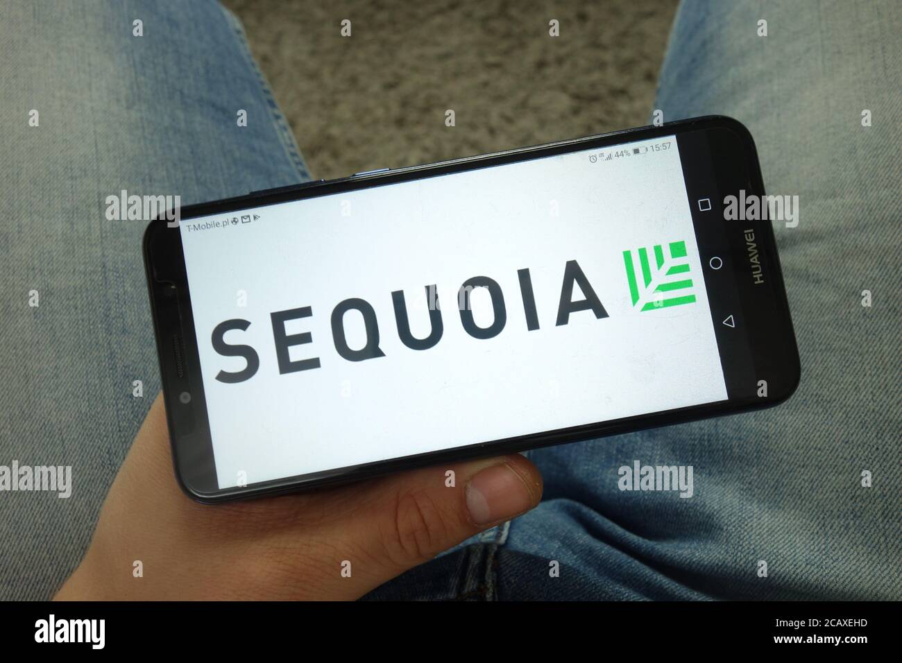 Man holding smartphone with Sequoia Capital firm logo Stock Photo - Alamy