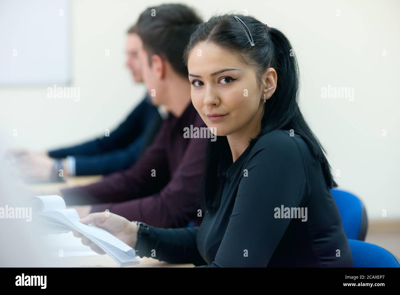 Exams Preparation. Group Of Multi-Ethnic Students Studying Together inside classroom while ...