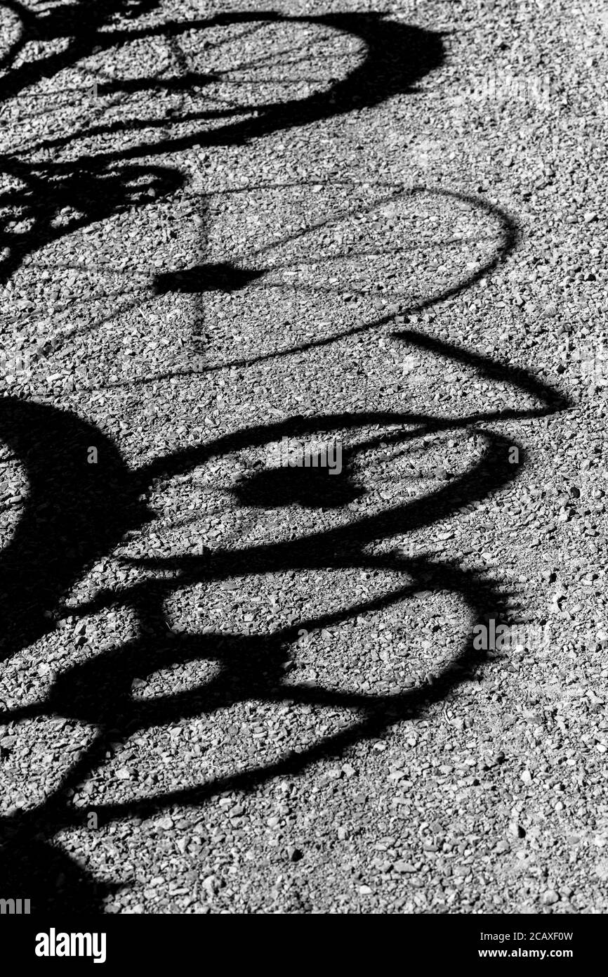 Shadows of Wheels on the Ground Stock Photo - Alamy