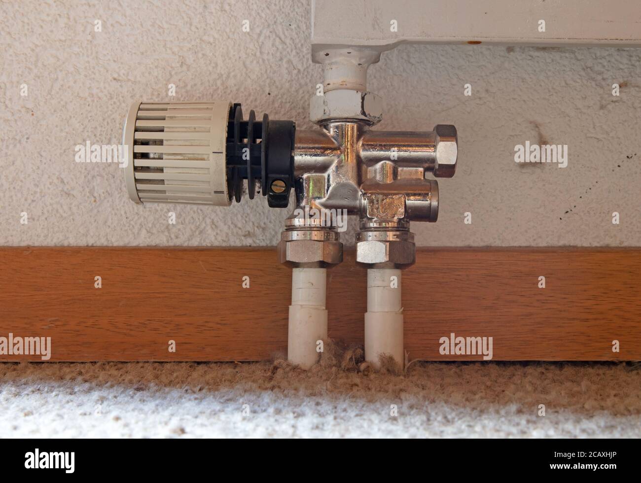 Heating radiator detail with adjusting knob, low to the ground Stock ...