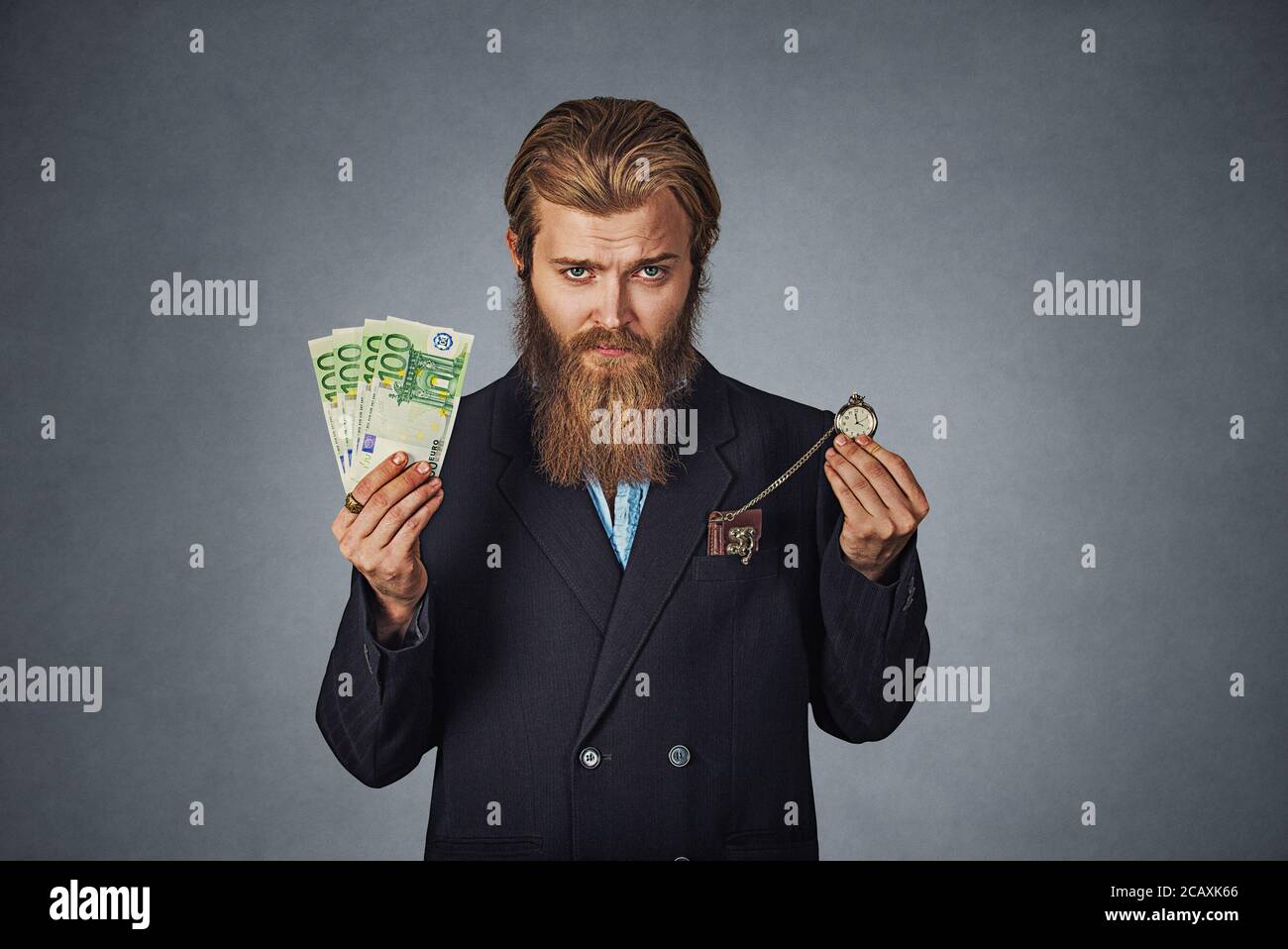 Time is money concept. Handsome Bearded hipster businessman man with ...