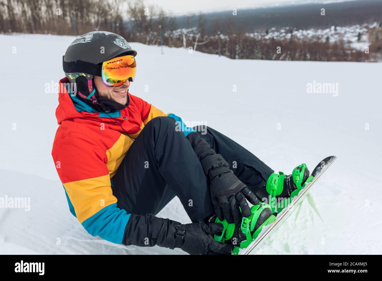 smiling pleasant guy spending time in the resort, side view photo Stock ...