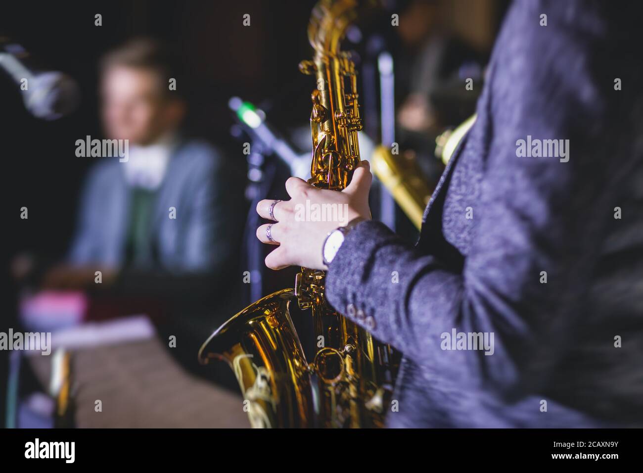 Concert view of a female saxophonist, professional saxophone player ...