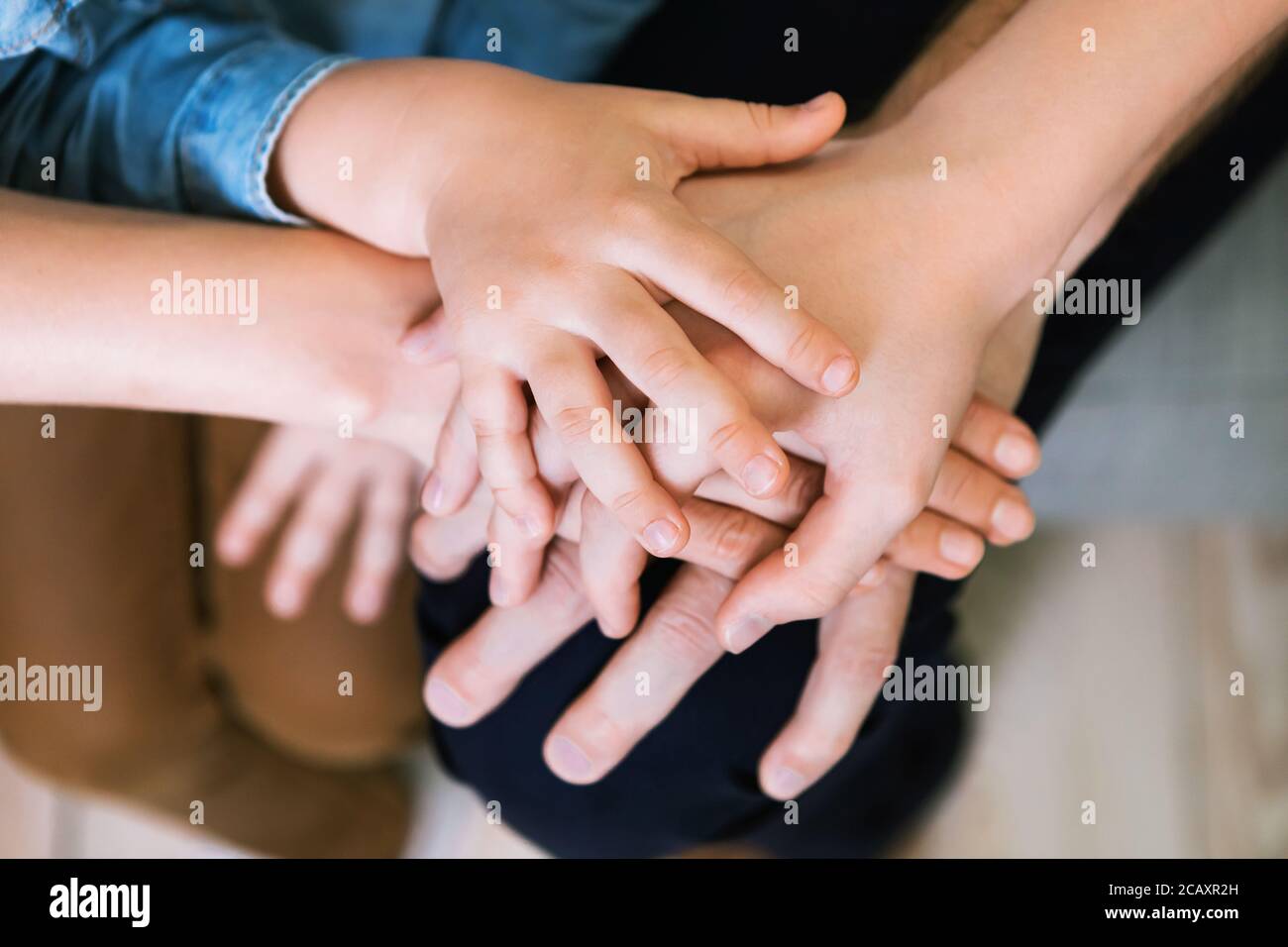 Kids holding hands parents hi-res stock photography and images - Alamy