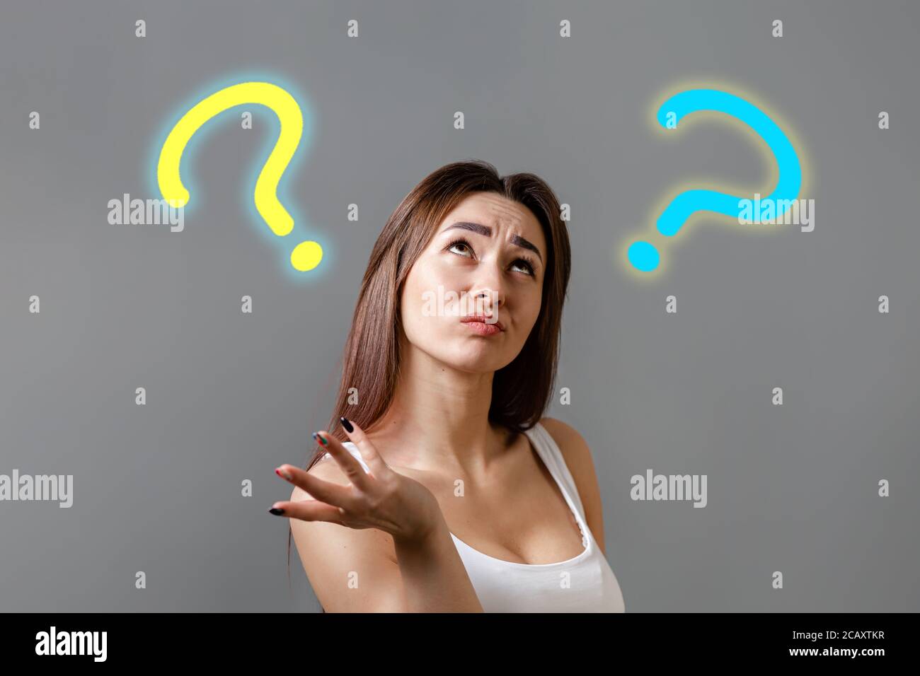 Woman thinking question marks hi-res stock photography and images - Alamy
