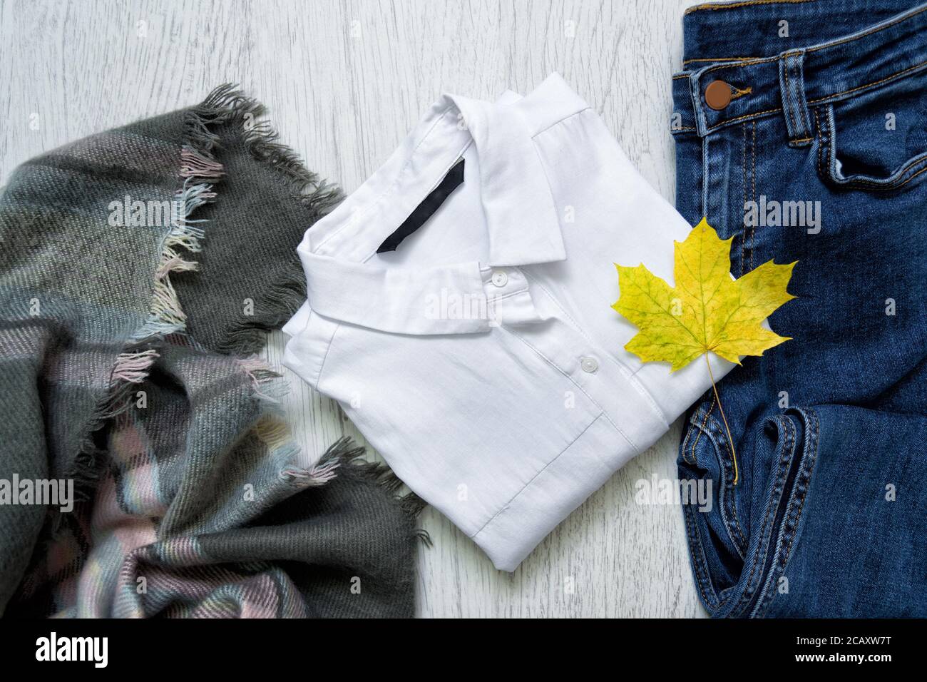 White shirt, jeans and a maple leaf. Fashionable concept Stock Photo ...