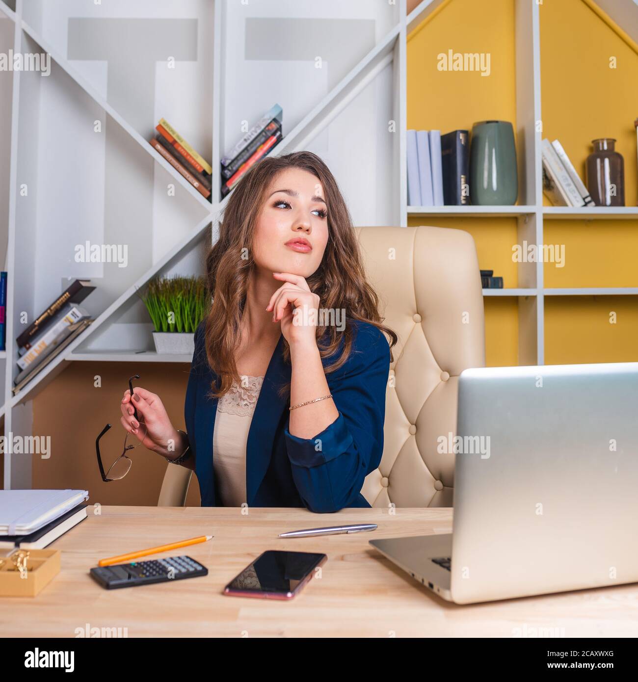 Pretty lady thinking with laptop hi-res stock photography and images ...
