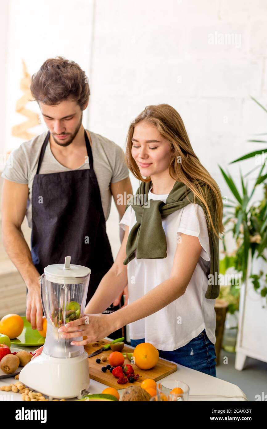 hardworking young people blending ingredients until smooth. close up ...
