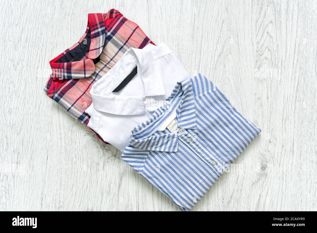 Three shirts white, checkered, striped. Collage. Fashionable concept ...