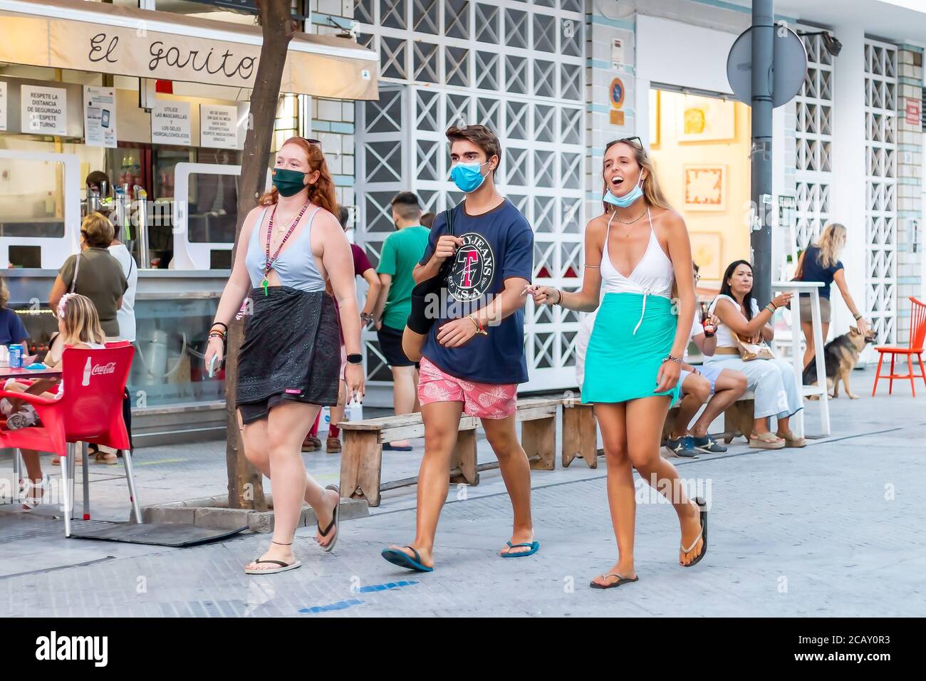 Punta Umbria, Huelva, Spain - August 7, 2020: Youngs walking by street ...