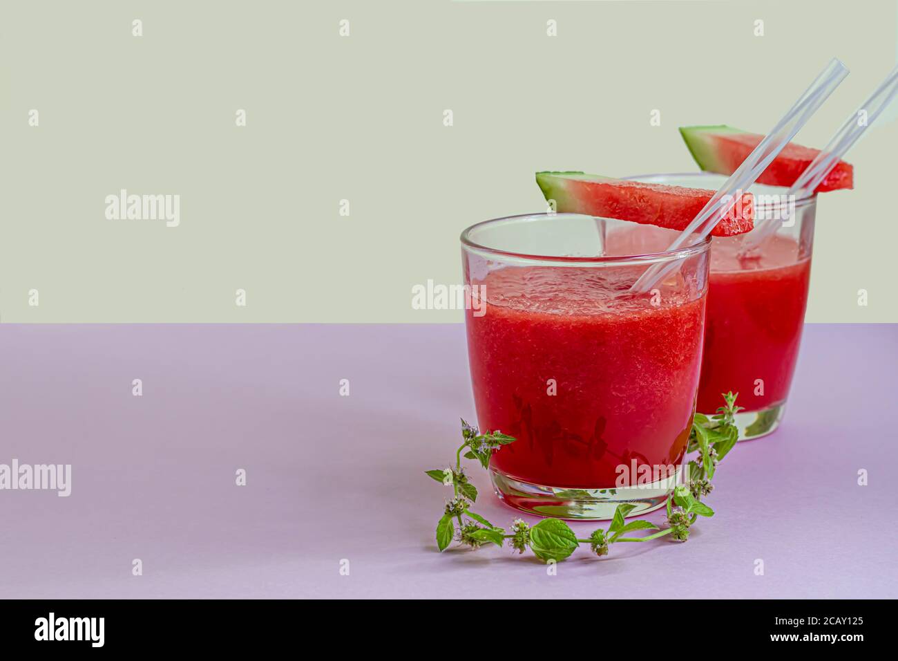 Watermelon pulp smoothie. Delicious red sliced watermelon on a plate ...