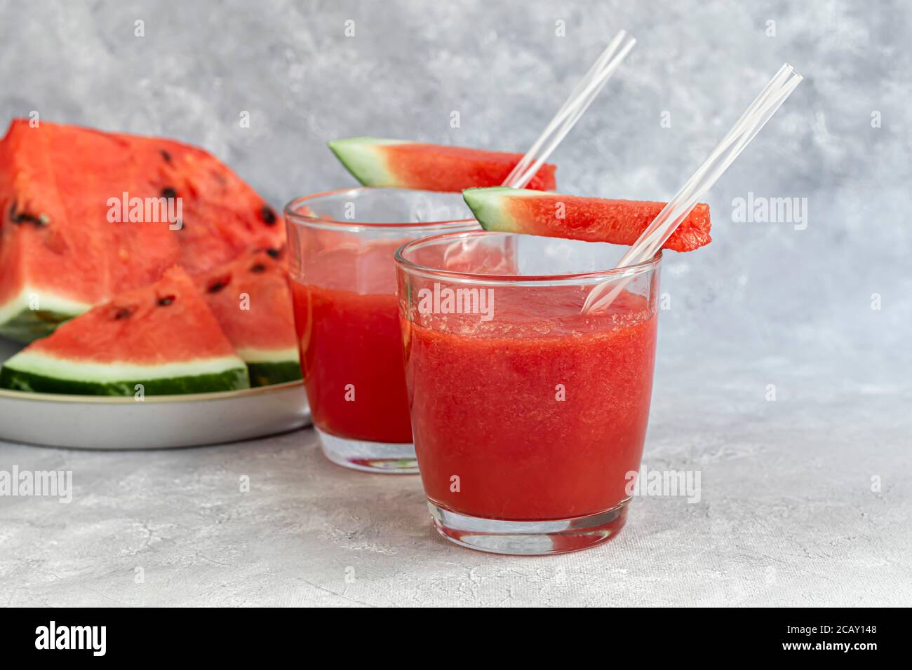 Watermelon pulp smoothie. Delicious red sliced watermelon on a plate ...