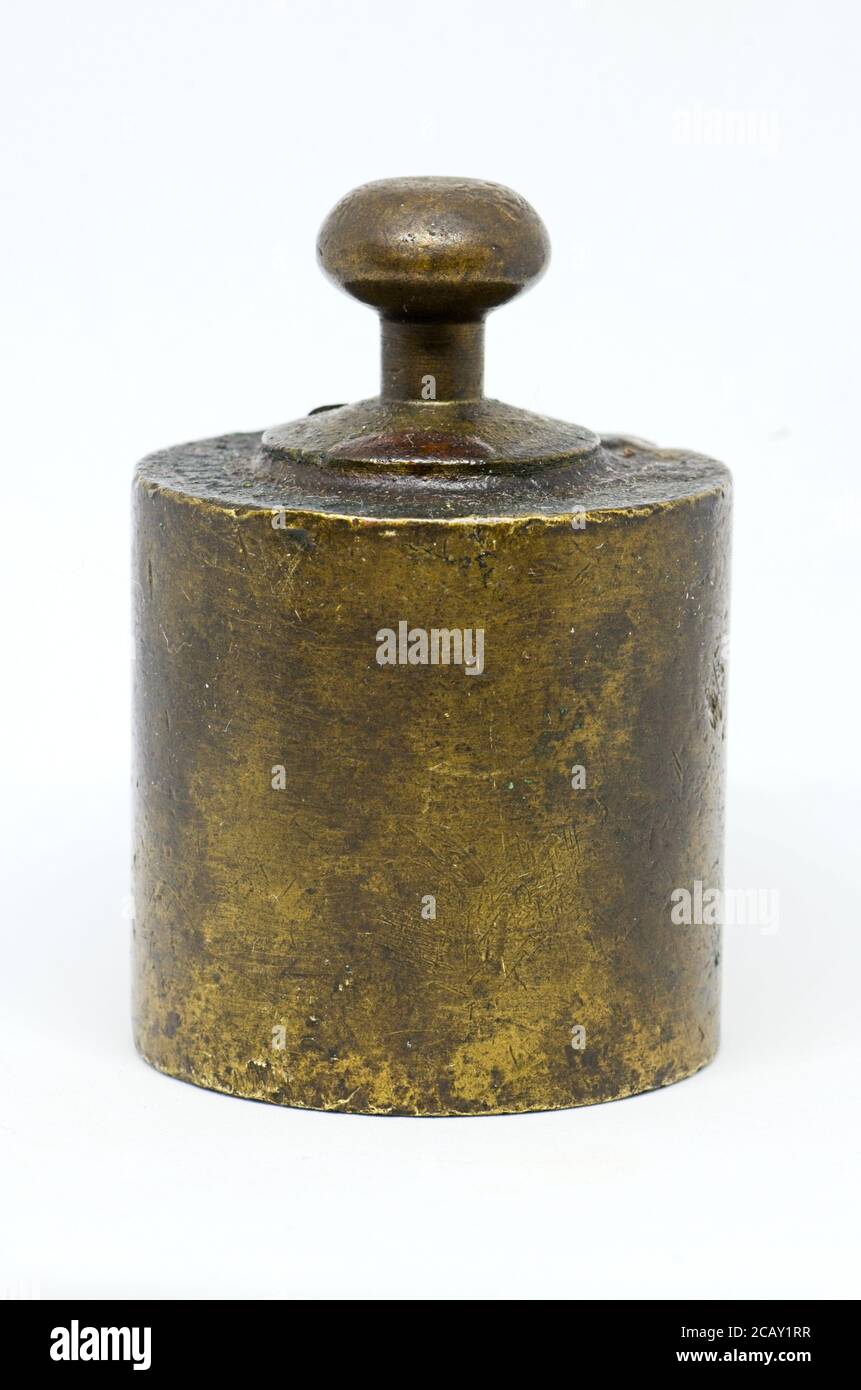 Iron weight on white background. Weighting tool Stock Photo - Alamy