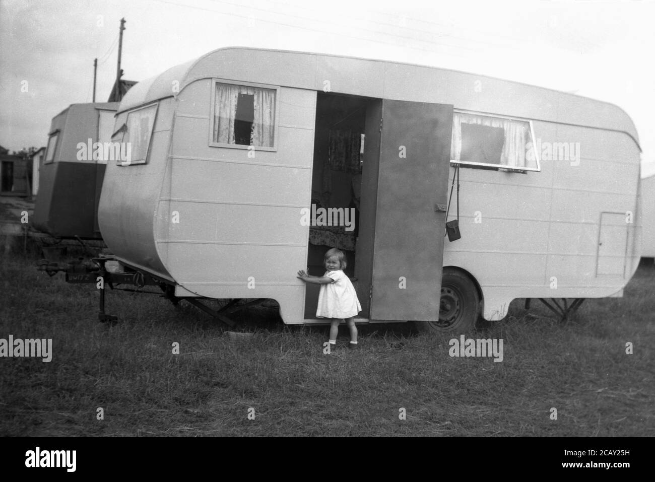 1950s, historical, outside at a caravan site, an infant child at the ...