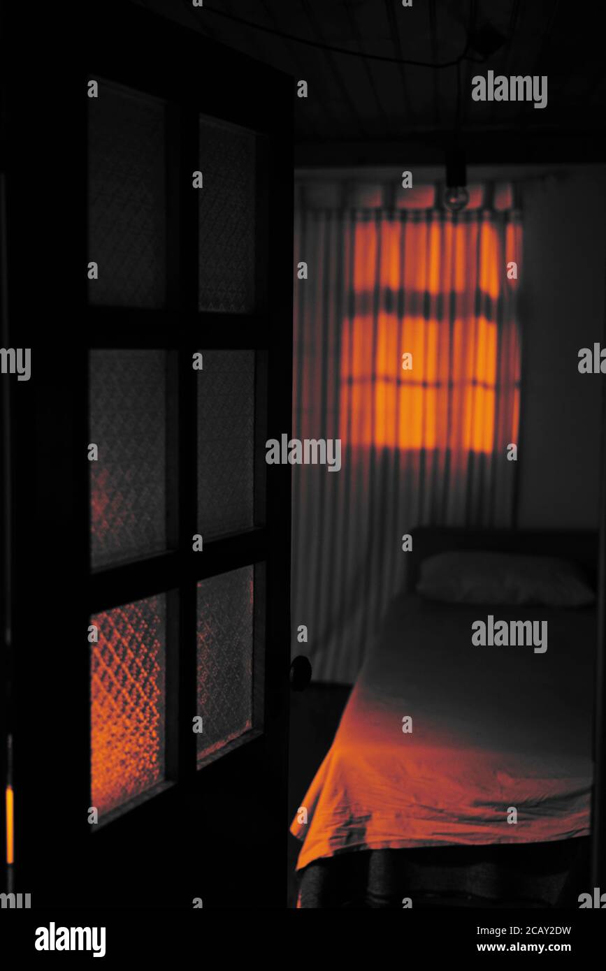 Dimly lit bedroom in an old house Stock Photo - Alamy