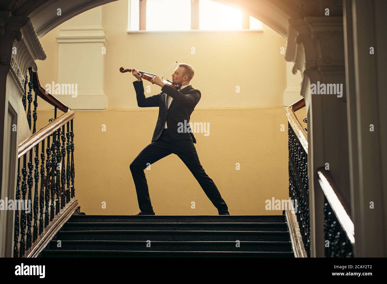 young professional musician man play violin, practicing, performing ...