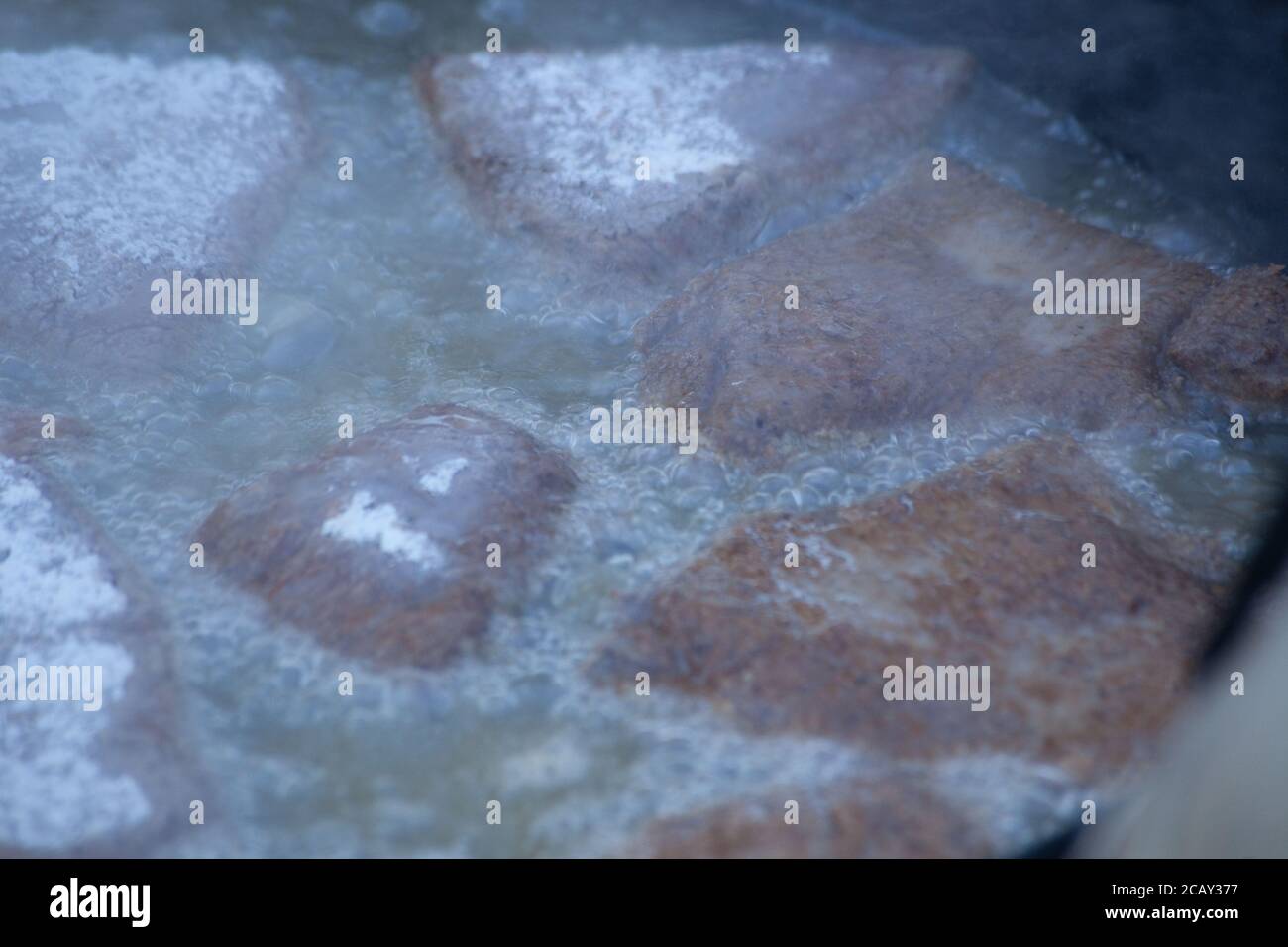 Cowboy cooking a meal over an open fire Stock Photo - Alamy