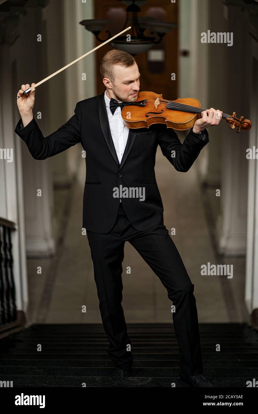 elegant talented professional violinist performing classical music ...