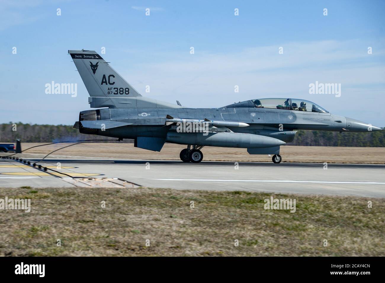 A U.S. Air Force F-16D Fighting Falcon lowers its tail hook and catches ...