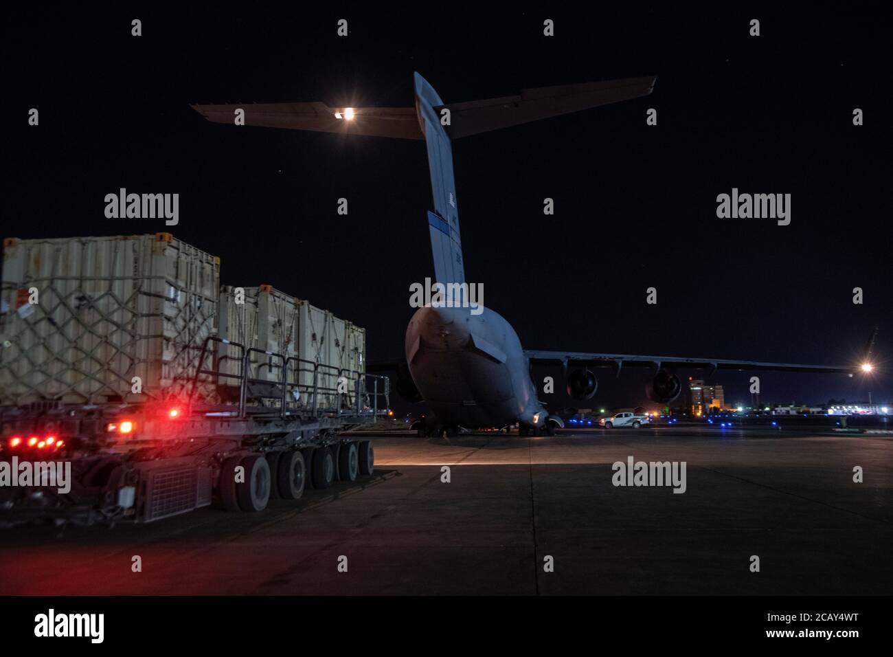 A K-loader with cargo is parked and ready to be loaded onto a C-17 ...