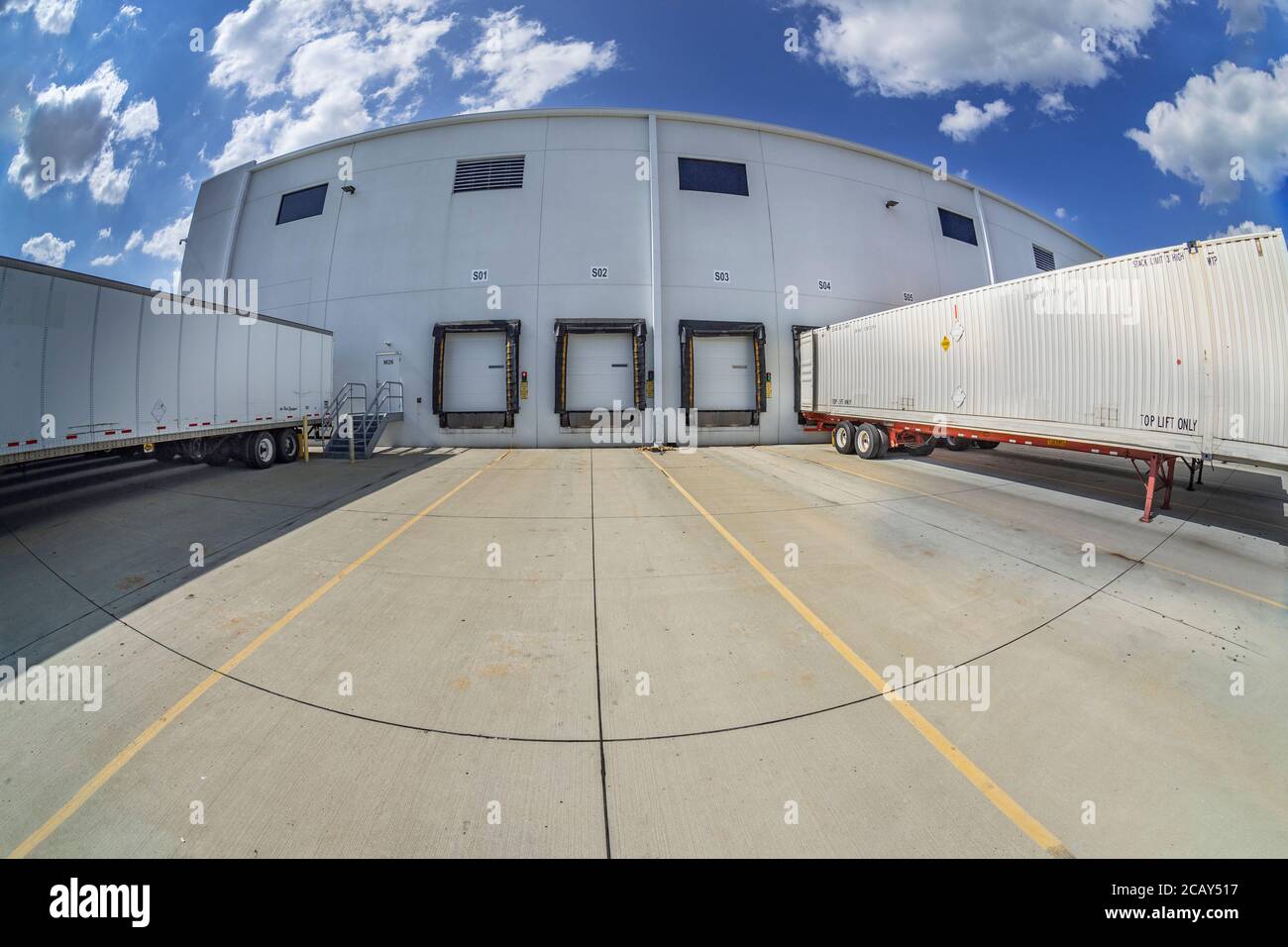 Warehouse with trucks Stock Photo - Alamy