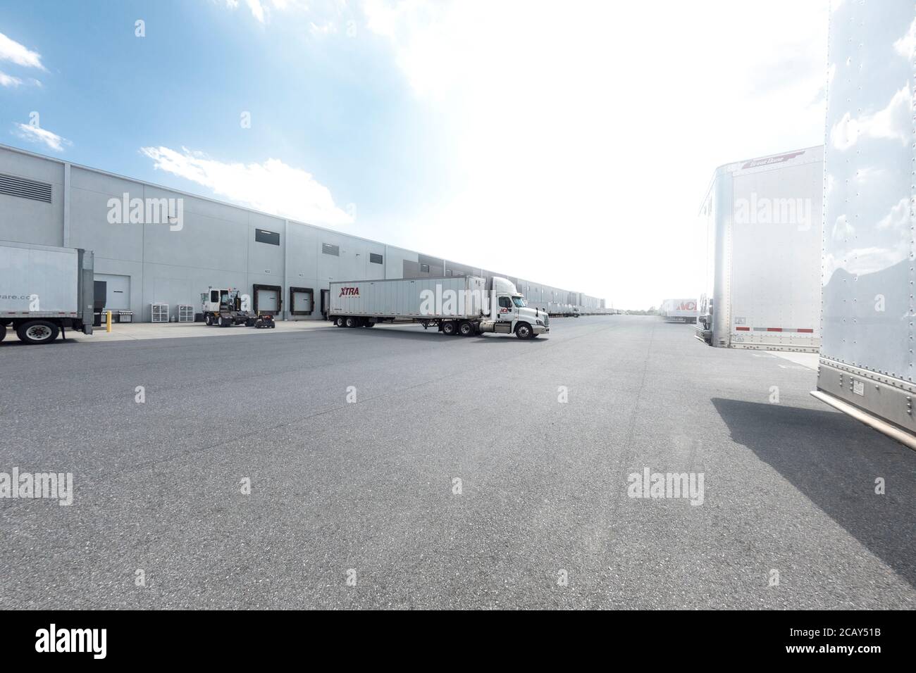 Warehouse with trucks Stock Photo - Alamy
