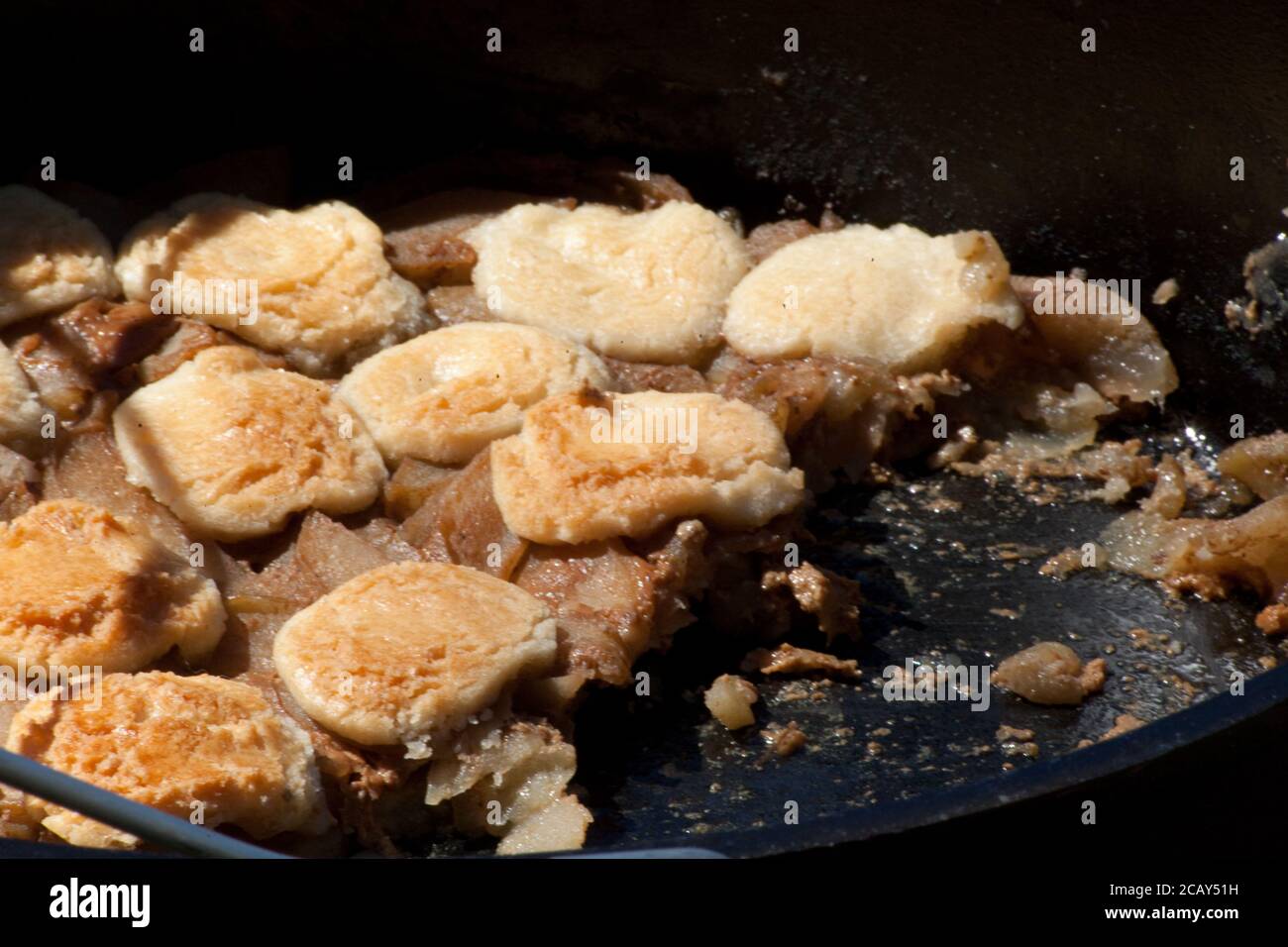 Cowboy cooking a meal over an open fire Stock Photo - Alamy