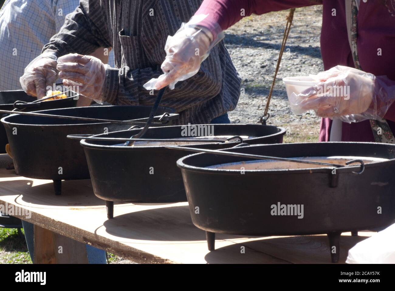 Cowboy cooking a meal over an open fire Stock Photo - Alamy