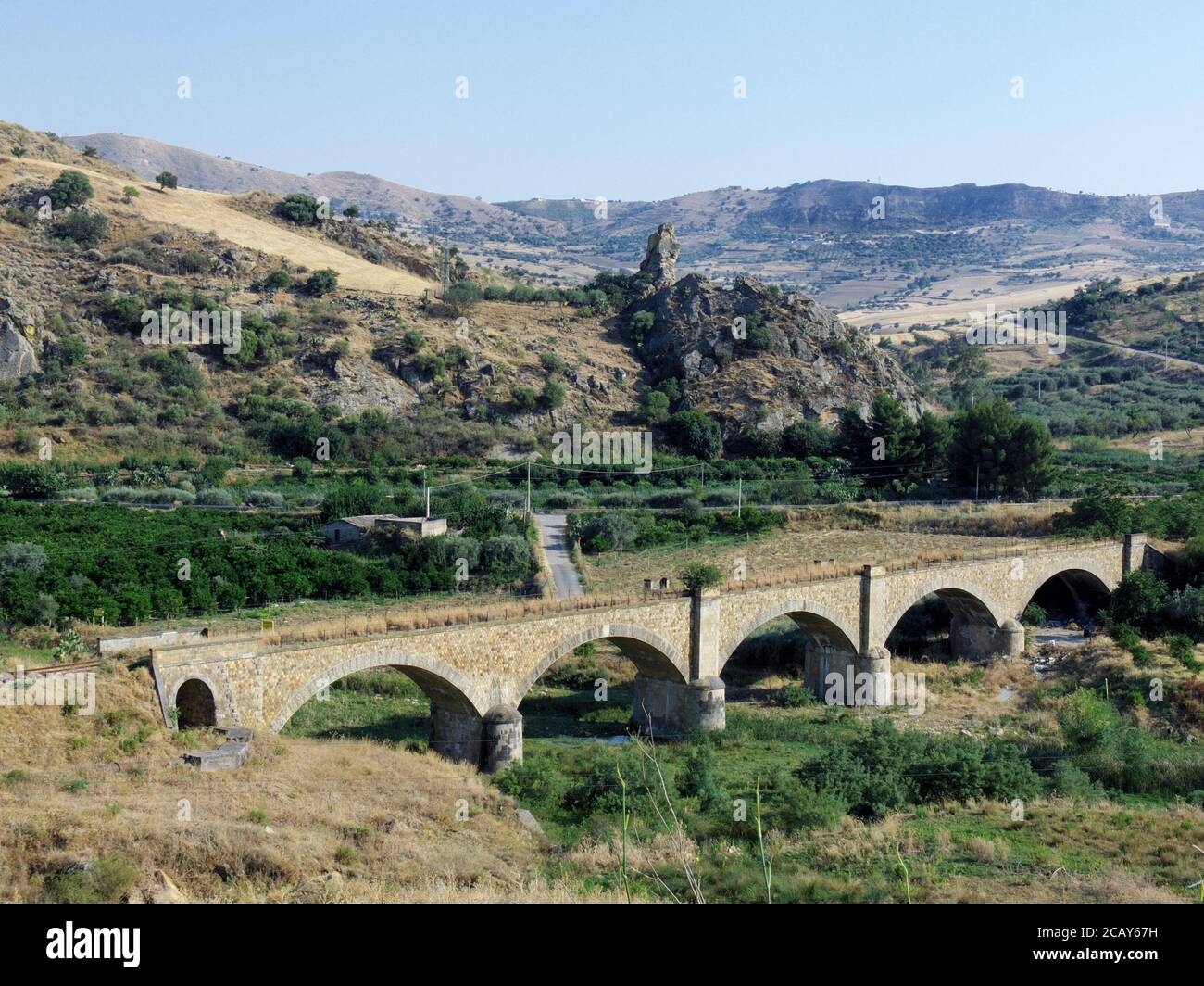 scenic view of Sicily on a rural valley with citrus gardens and crossed ...