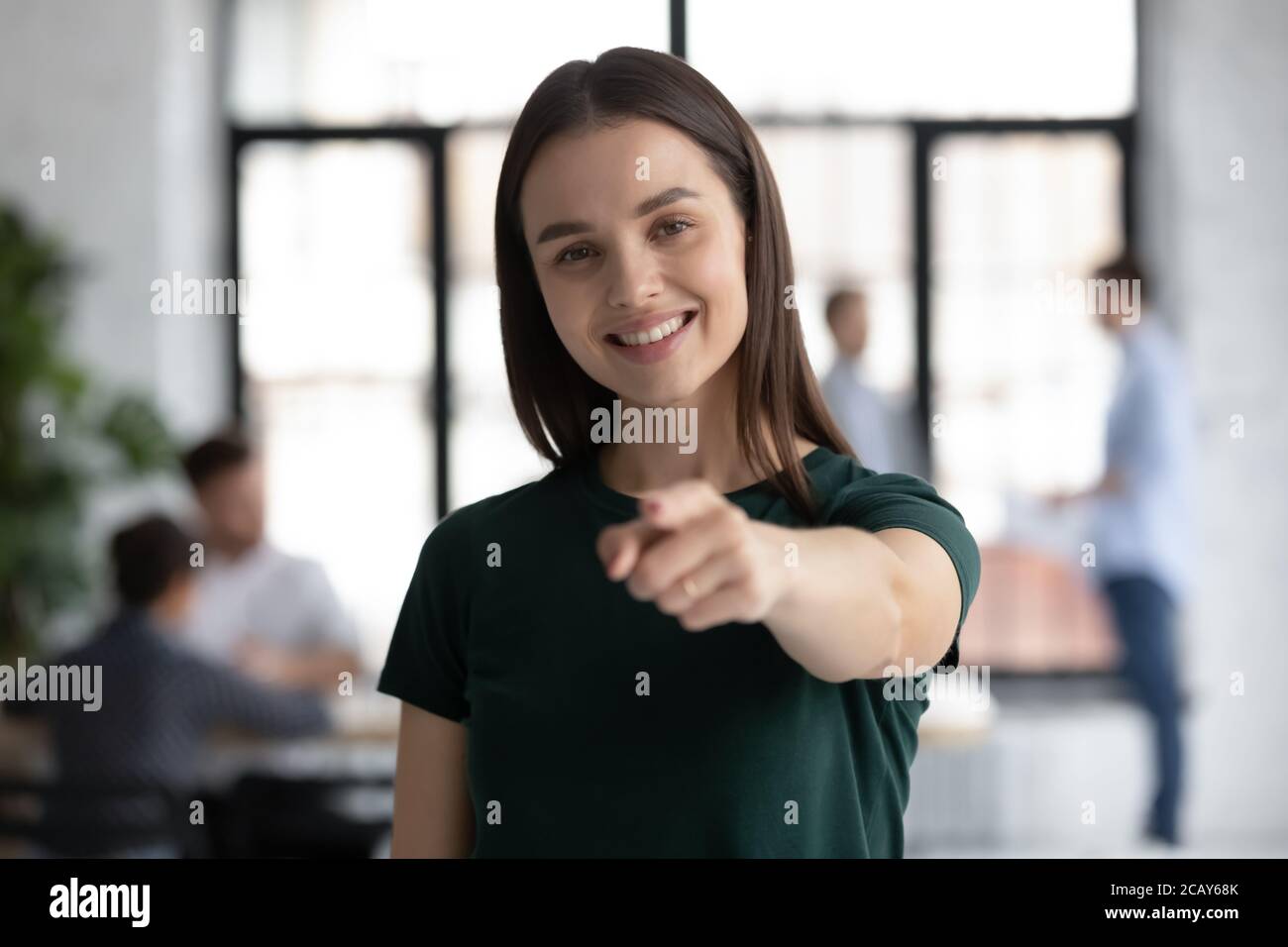 Head shot smiling businesswoman hr manager pointing finger at camera ...