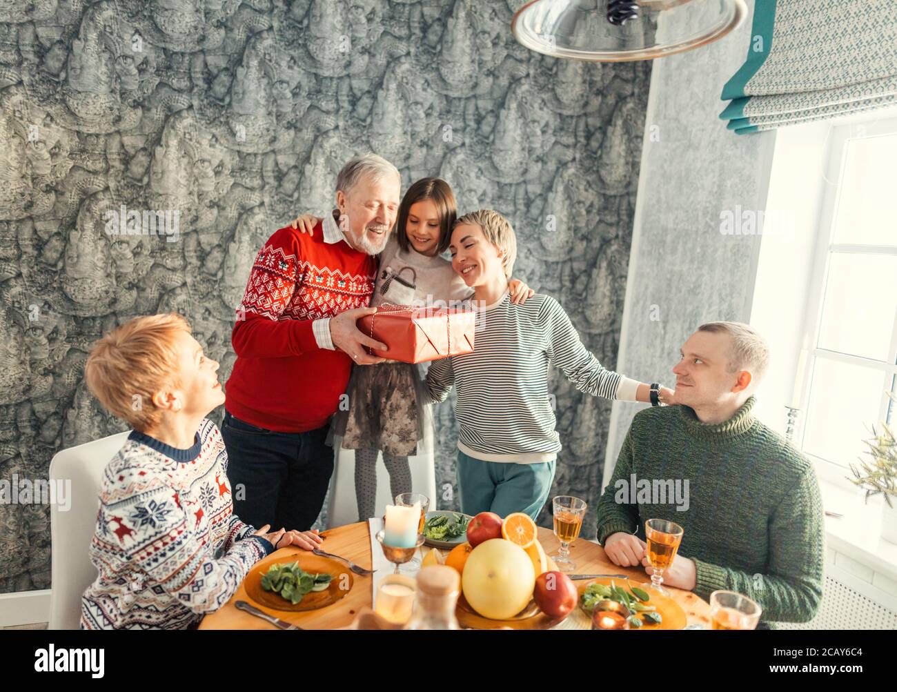 happy little girl has recieved a gift from family. happiness, best ...