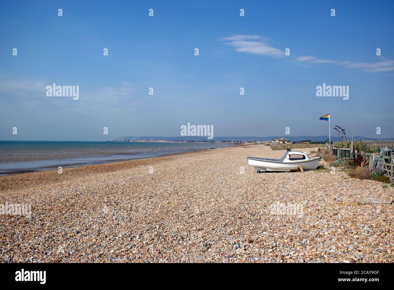 A view west towards Easbourne and Beachy Head from the shingle beach of ...