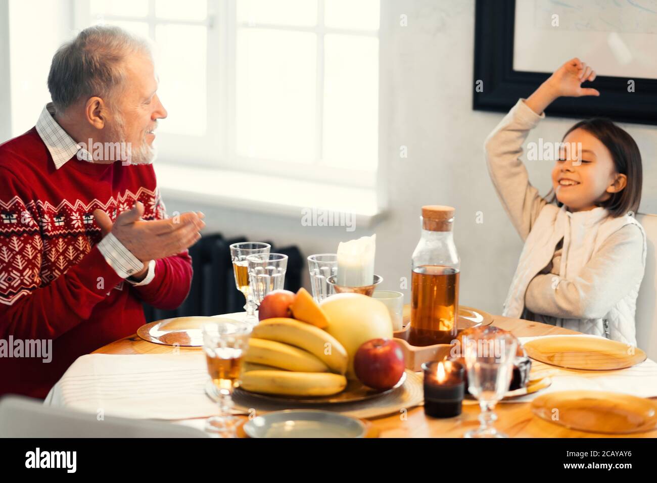 old man and his granddad having meal at home. close up croped photo ...