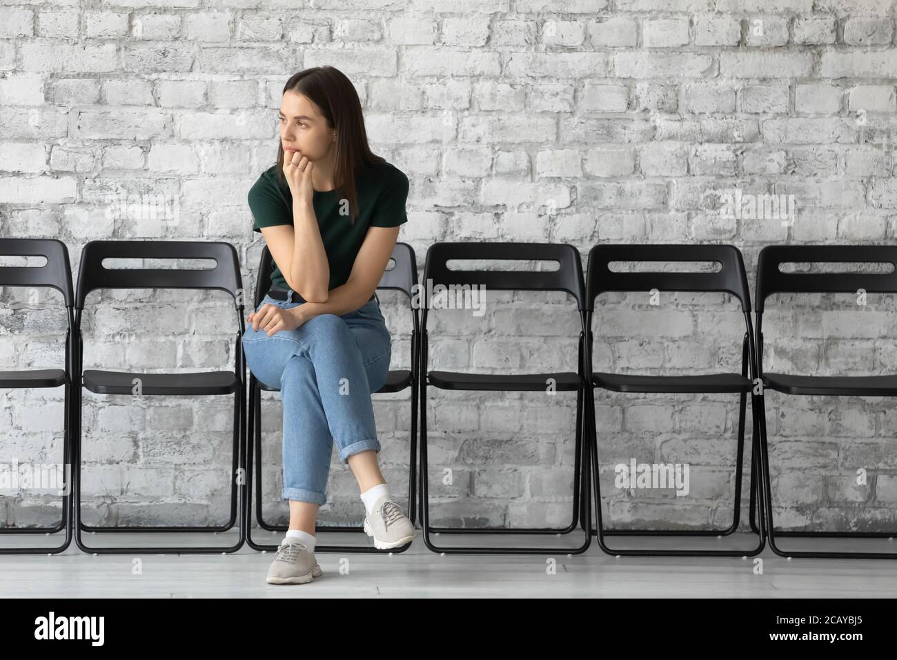 Young alone row wait interview office hi-res stock photography and ...