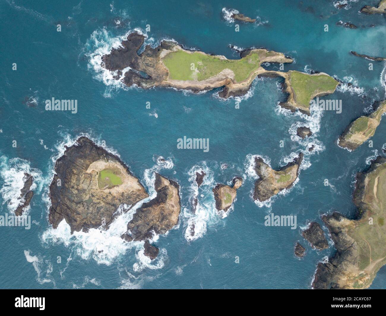 The cold water of the Pacific Ocean washes onto the coast of Mendocino ...