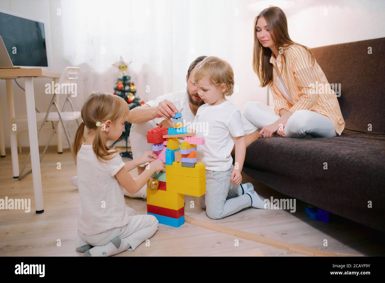 Man looking after children hi-res stock photography and images - Alamy