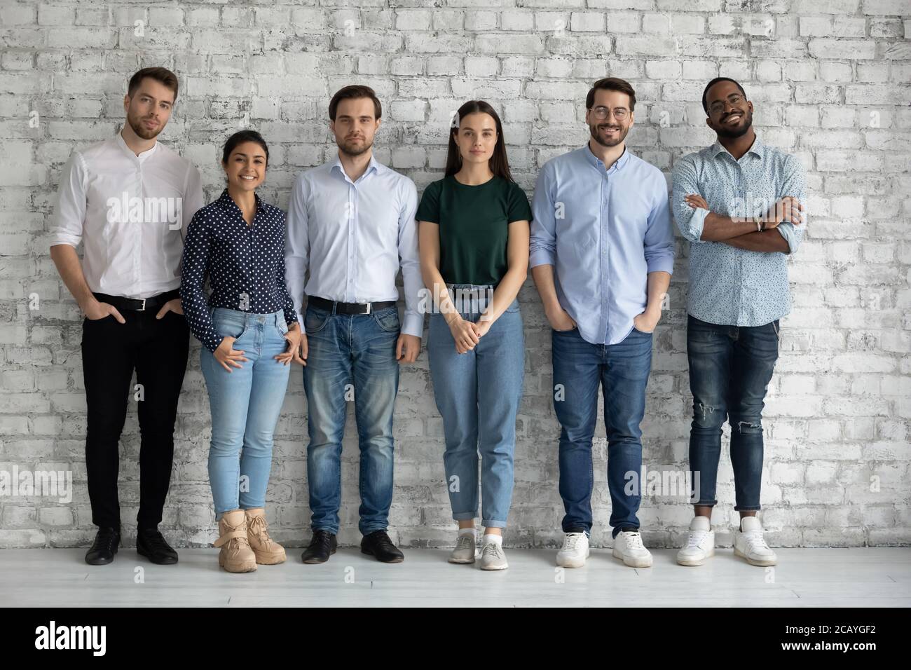 Full length portrait motivated successful diverse employees team ...