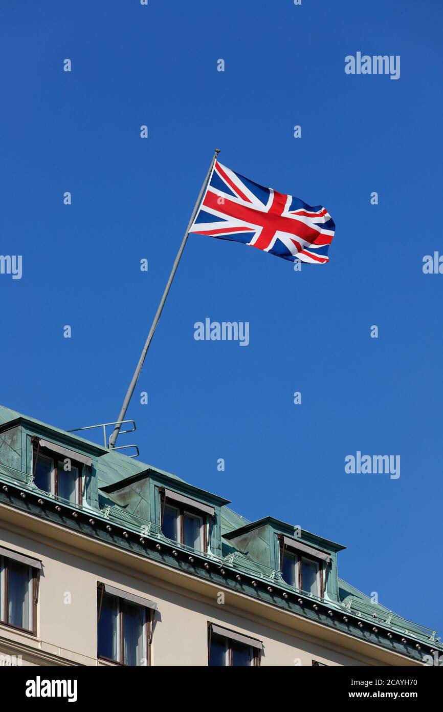 Low angle view of the British flag hoisted on a roof top Stock Photo ...