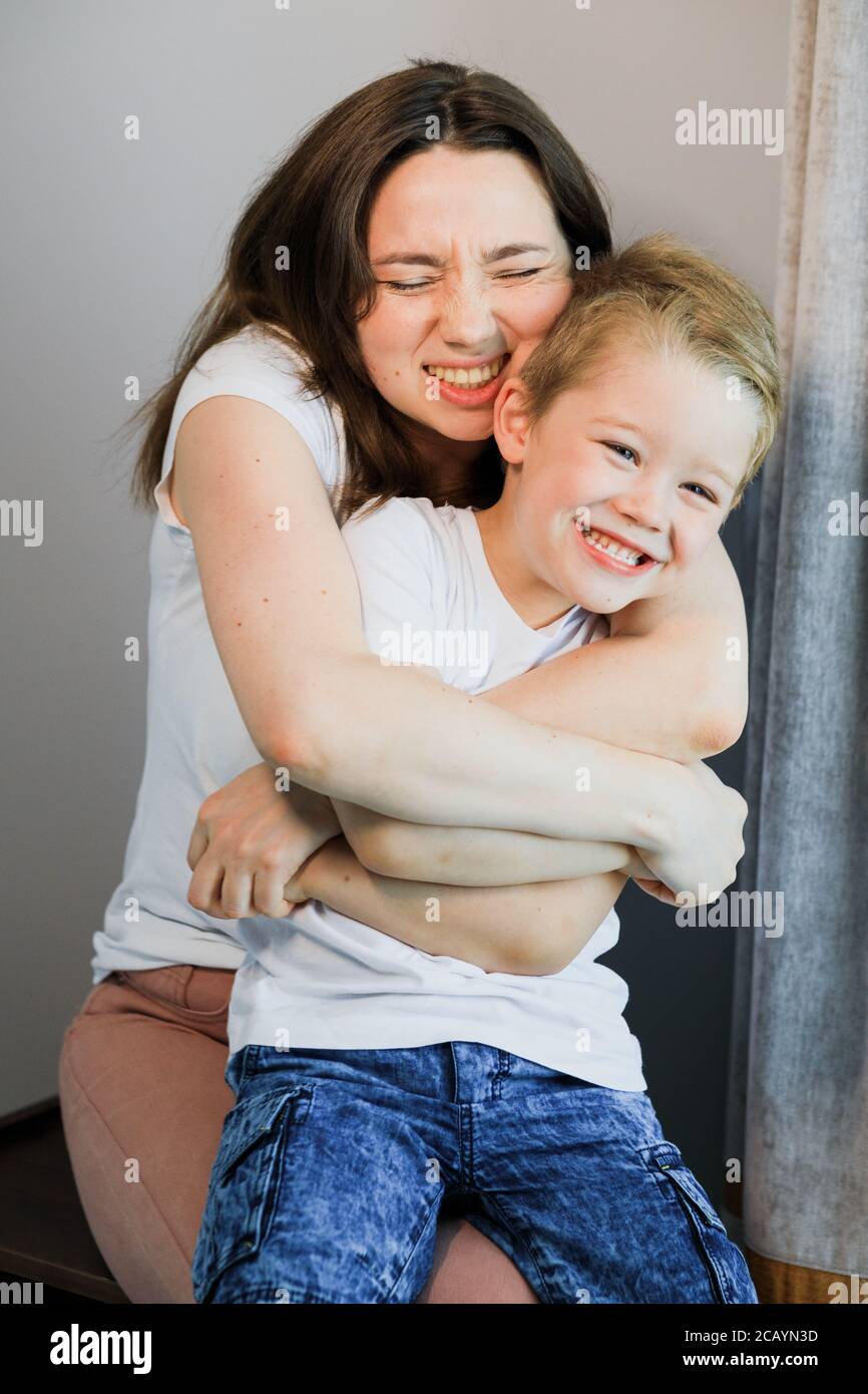 A mother hugs her child Stock Photo - Alamy