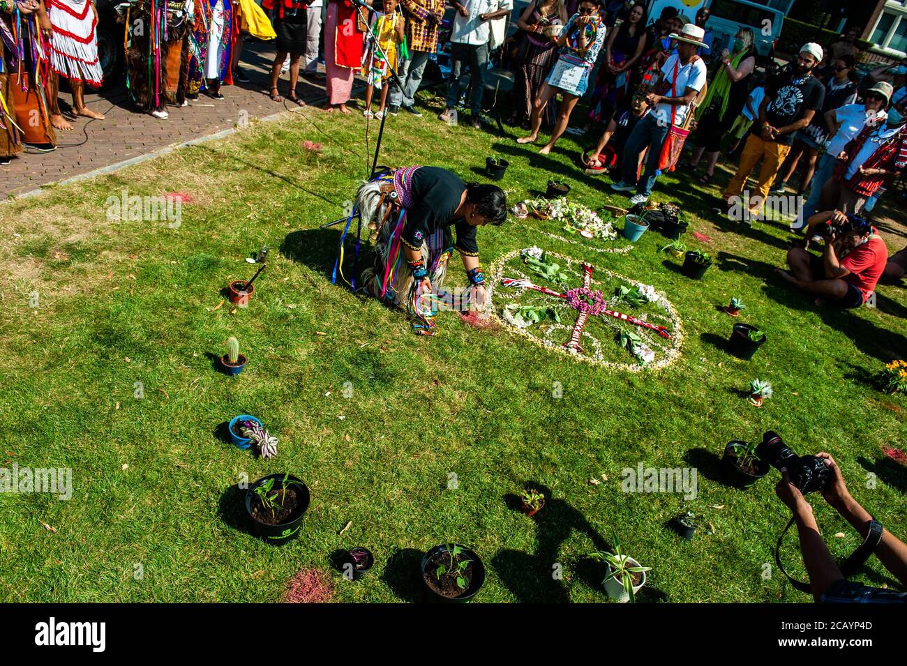 A woman taking part in a traditional indigenous ceremony during the ...