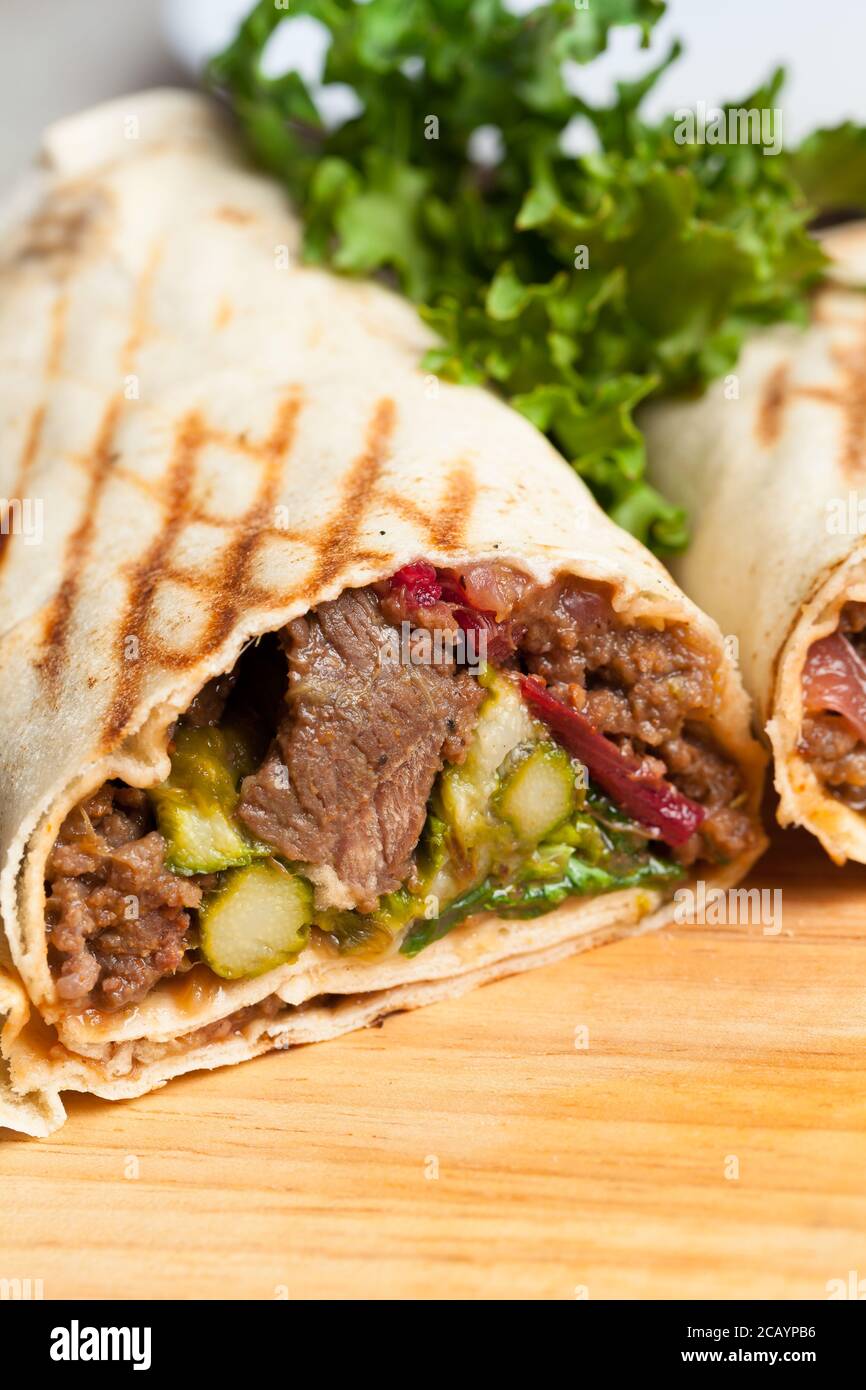 burrito wrap with seasoned beef and pickles Stock Photo - Alamy