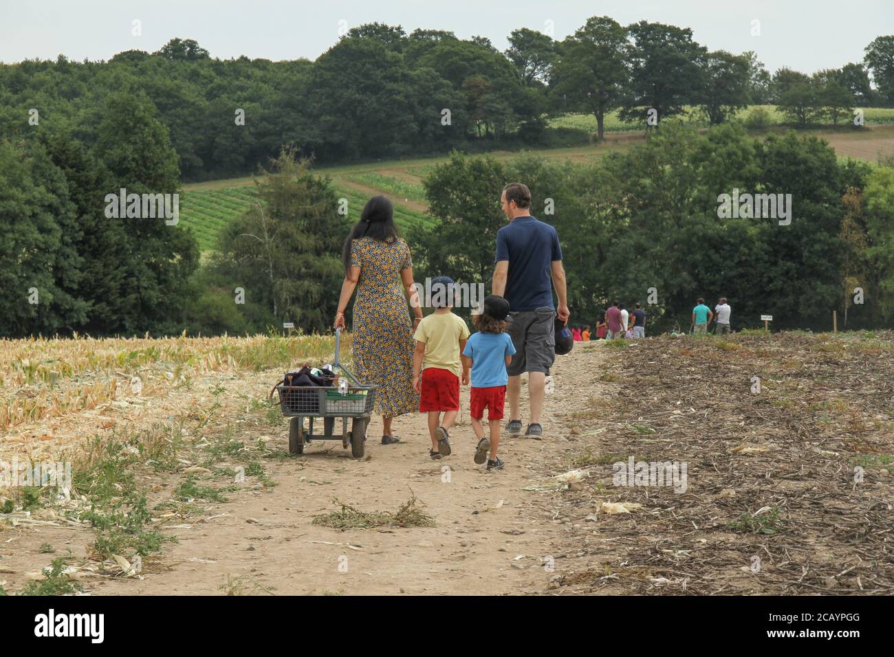 People walk across a farmyard at the Pick you Own farm.Pick your own ...